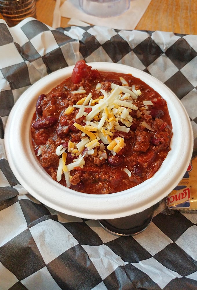 Chili that doesn't mess around—hearty, meaty, and topped with just enough cheese to make you wonder why you'd ever eat it any other way.