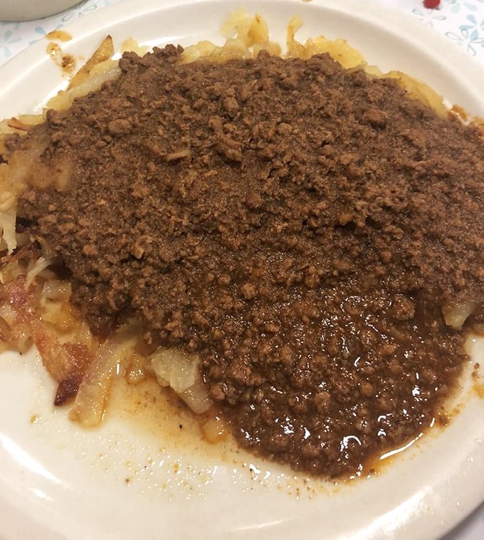 Cincinnati chili over fries – a beautiful mess of spiced meat sauce that locals defend with religious fervor and outsiders approach with curious delight.