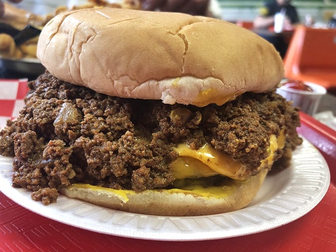 The legendary chili cheeseburger doesn't just sit on the plate—it commands attention. That mountain of seasoned beef could have its own zip code.