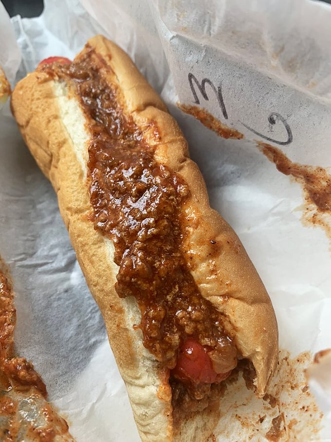 The chili dog that launched a thousand road trips. That homemade chili doesn't just sit on the hot dog—it transforms it.