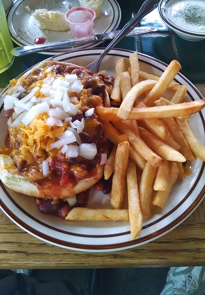 Chili, cheese, and onions transform an ordinary burger into something worth crossing county lines for. The fries aren't bad company either.