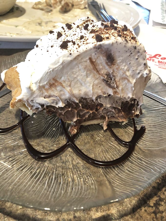 This chocolate cream pie doesn't just end a meal—it's the reason you saved room. Architecture meets dessert in a masterpiece of layers.