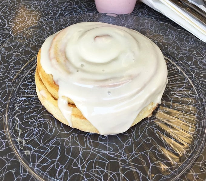 This cinnamon bun isn't just food—it's therapy with frosting. The swirl pattern hypnotizes while the aroma seduces.