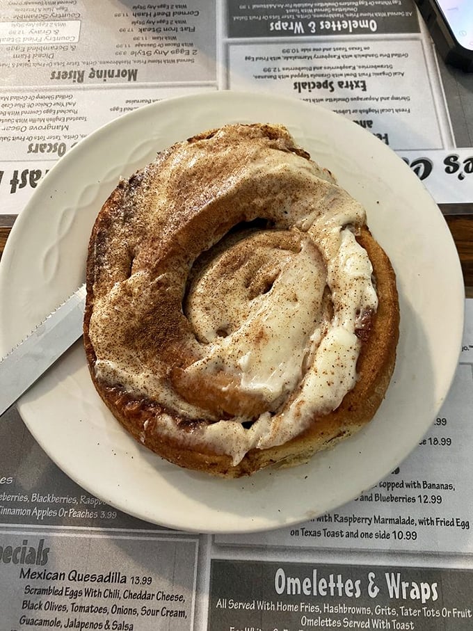 This cinnamon roll isn't just breakfast—it's an event. Swirled perfection with cream cheese icing that would make even your strictest nutritionist whisper, "Go for it."