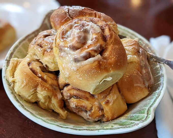 These aren't just cinnamon rolls; they're pillowy spirals of morning joy, glistening with glaze that'll make you forget every diet promise.