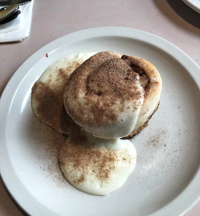 This cinnamon roll isn't just dessert pretending to be breakfast—it's breakfast living its best life. The icing melts with purpose, not apology.