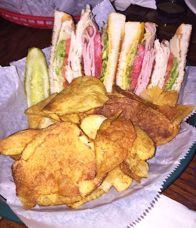 This club sandwich isn't playing around – stacked higher than my college debt and twice as satisfying. Those house-made chips deserve their own fan club.