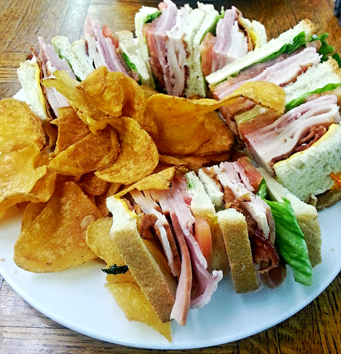 Layer upon glorious layer of deli meats and fresh veggies, this club sandwich doesn't just satisfy hunger—it obliterates it with delicious precision.