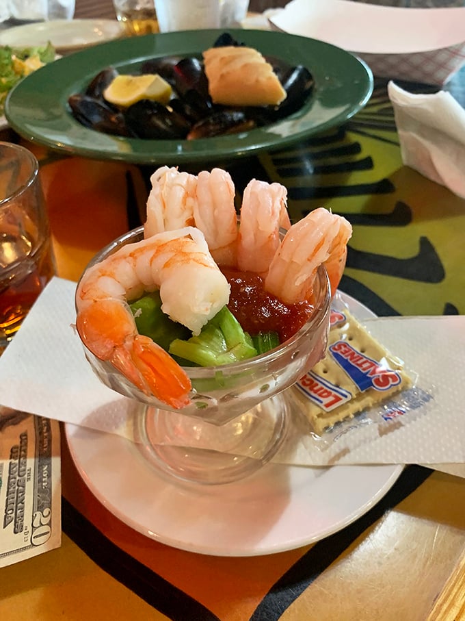 Shrimp cocktail, elevated – plump crustaceans perched on the rim of a glass, ready to take a dive into that spicy sauce below.