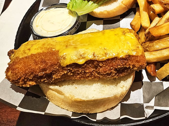 The codfish sandwich – where the Atlantic Ocean meets the deep fryer in a crispy, golden embrace that puts fast-food fish to shame.