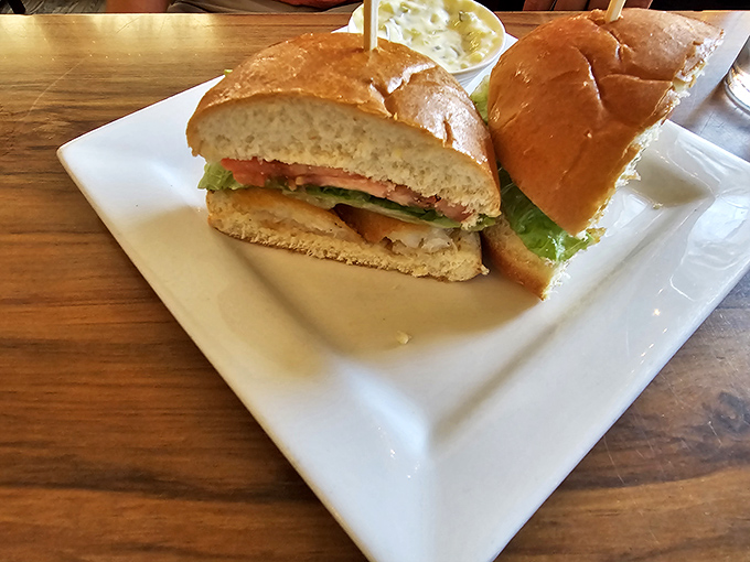 The cod sandwich arrives like an old friend – familiar, comforting, and exactly what you needed without even knowing it.