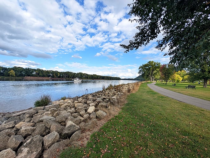 Colvill Park's riverside path invites leisurely strolls where the Mississippi's gentle current matches your suddenly unhurried pace.