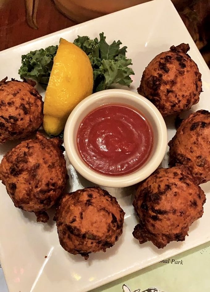 Conch fritters that look like they've been kissed by the sun—golden-brown spheres of Keys tradition served with a sauce that means business.