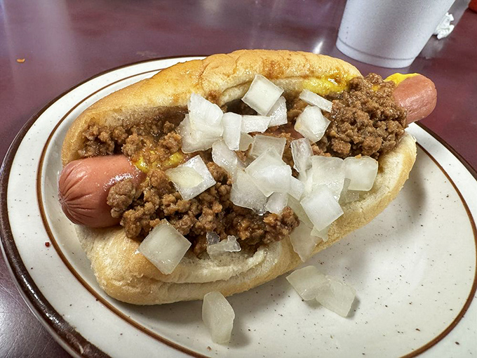 The Coney Dog at Powers isn't trying to win a beauty pageant, but it's definitely winning the flavor Olympics with that hearty chili and diced onion topping.