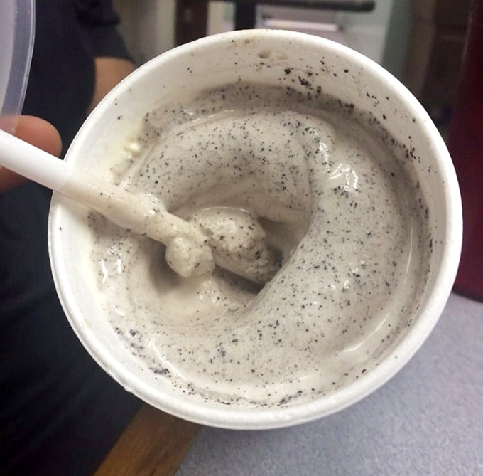 This cookies and cream milkshake isn't just a drink – it's a spoonable, straw-defying monument to dairy perfection with specks of cookie goodness.