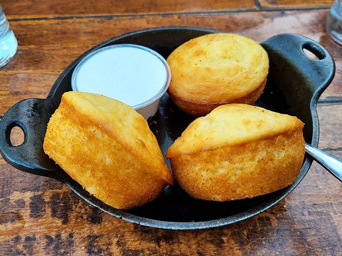 Golden cornbread that doesn't need your sympathy butter – it stands proud on its own merits while still graciously accepting a slather of honey butter.