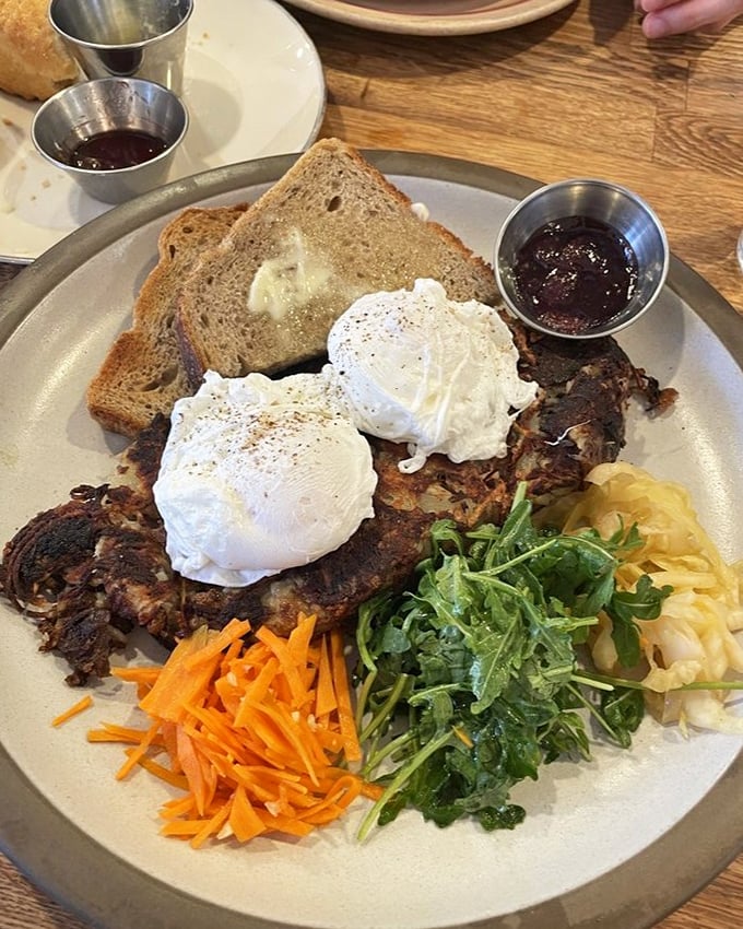 Hash done right looks like this – poached eggs playing peek-a-boo with colorful veggies and serious potato action.