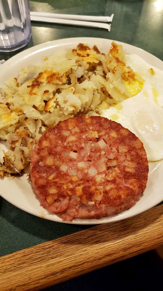 Breakfast doesn't get more honest than this – crispy home fries, perfectly cooked eggs, and a goetta patty that screams "Cincinnati."