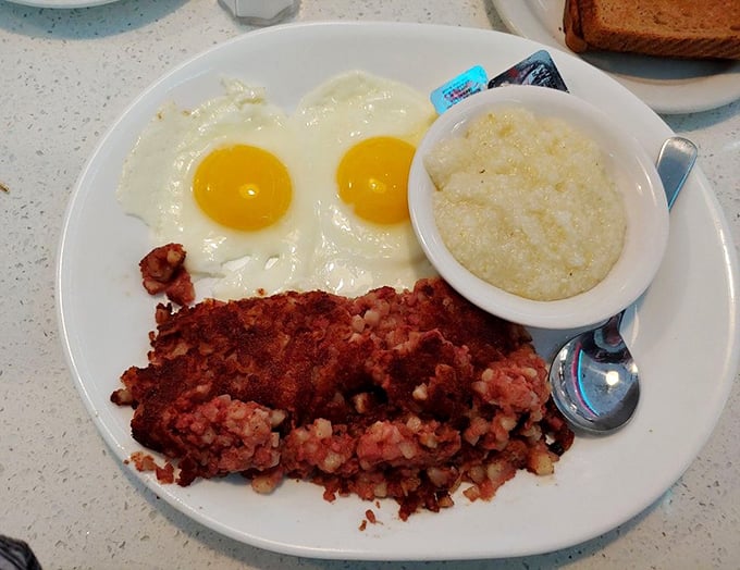 Crispy-edged corned beef hash with perfectly sunny-side-up eggs—the breakfast equivalent of hitting the jackpot on your first pull of the slot machine.