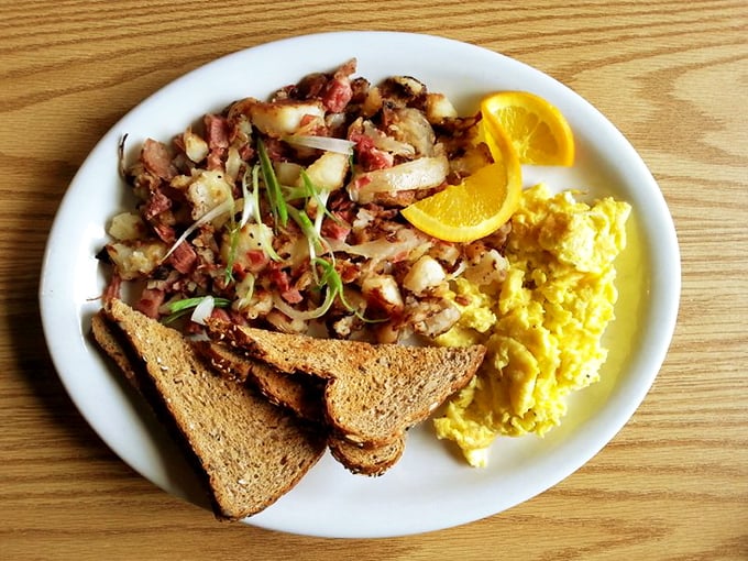 Corned beef hash that doesn't come from a can – chunky potatoes, savory meat, and eggs sunny enough to brighten even an Oregon rainy day.