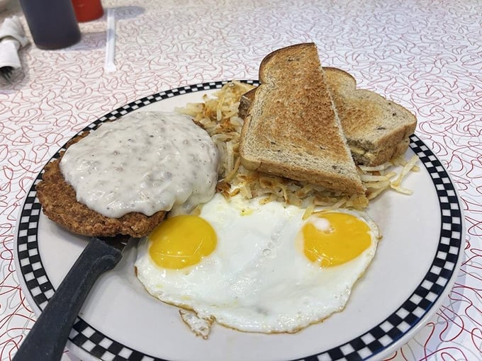 Country fried steak with gravy, sunny-side-up eggs, and toast—the holy trinity of diner breakfasts that could fuel you through building a barn or just browsing antique shops.