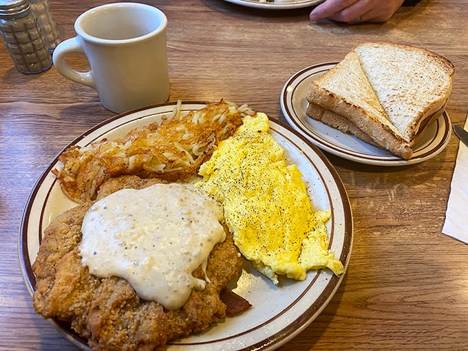 Country fried steak with pepper gravy, eggs, and hash browns—the breakfast equivalent of a warm hug from your favorite aunt.