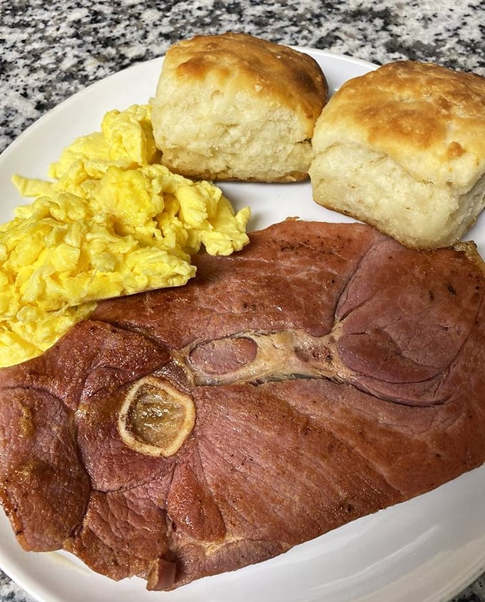 Country ham thick enough to make a lumberjack weep with pure breakfast joy.