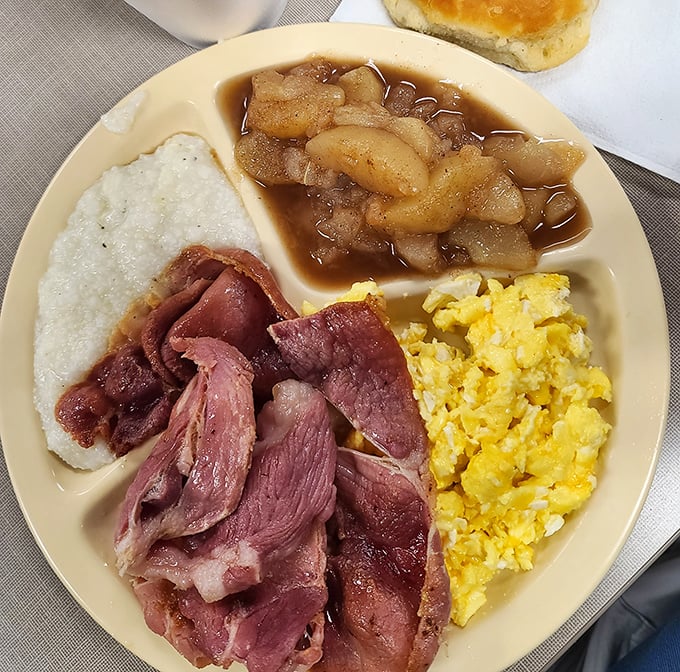 Country ham, scrambled eggs, and stewed apples—a holy trinity of Southern breakfast that whispers, "Take your time, the day can wait."