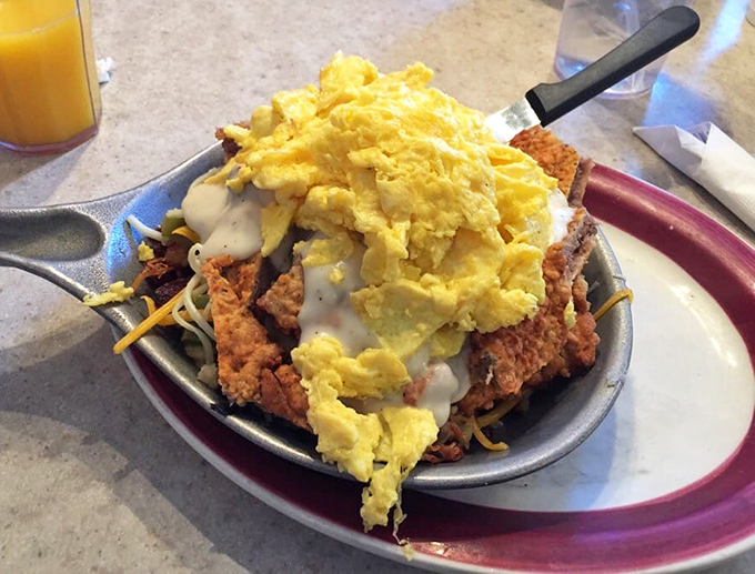 This skillet breakfast isn't just a meal, it's an architectural achievement – layers of flavor stacked higher than my hopes for fitting into last year's jeans.