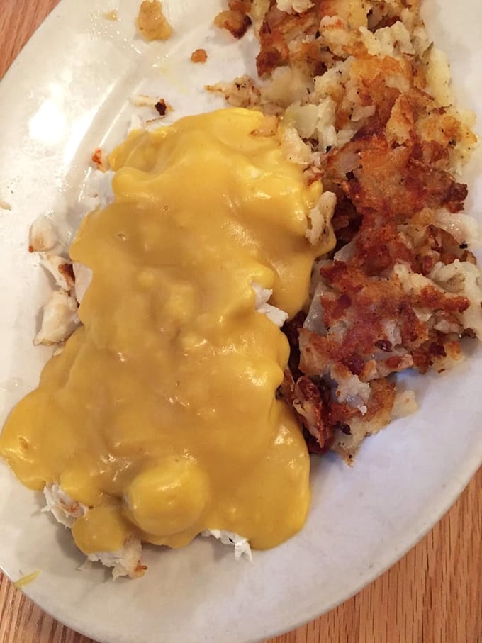 Hollandaise sauce cascading over perfectly cooked potatoes – proof that some morning masterpieces don't require fancy art school credentials.
