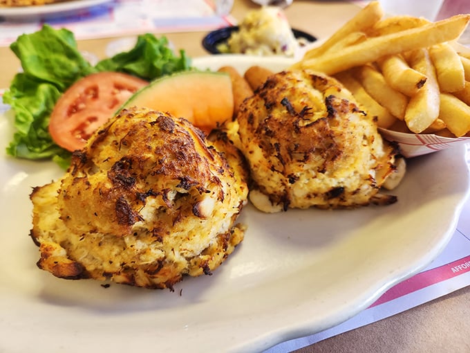 Crab cakes that are actually crab, not breadcrumbs with a hint of seafood – a Maryland miracle served with simple, perfect sides.