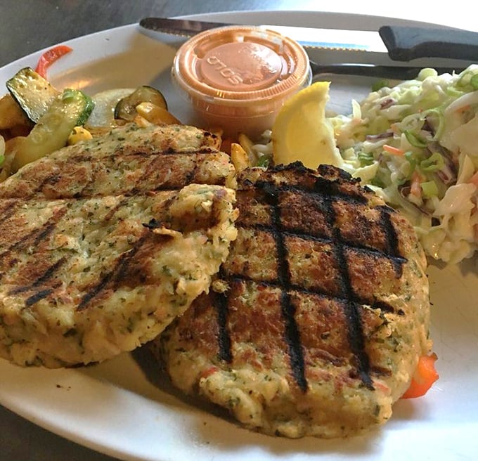 These crab cakes aren't just grilled—they're given a spa treatment of herbs and butter before meeting the perfect char marks.