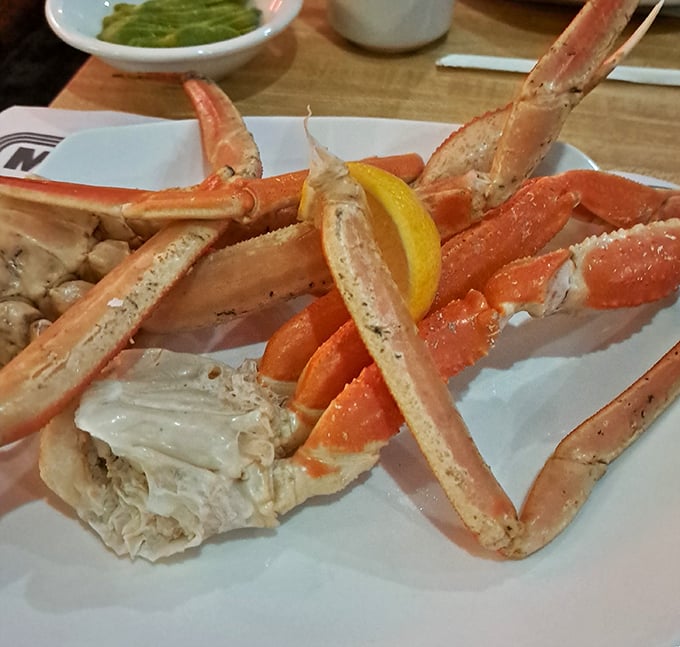 Snow crab legs splayed like nature's perfect eating utensils—the seafood equivalent of potato chips where you simply cannot stop at one section.
