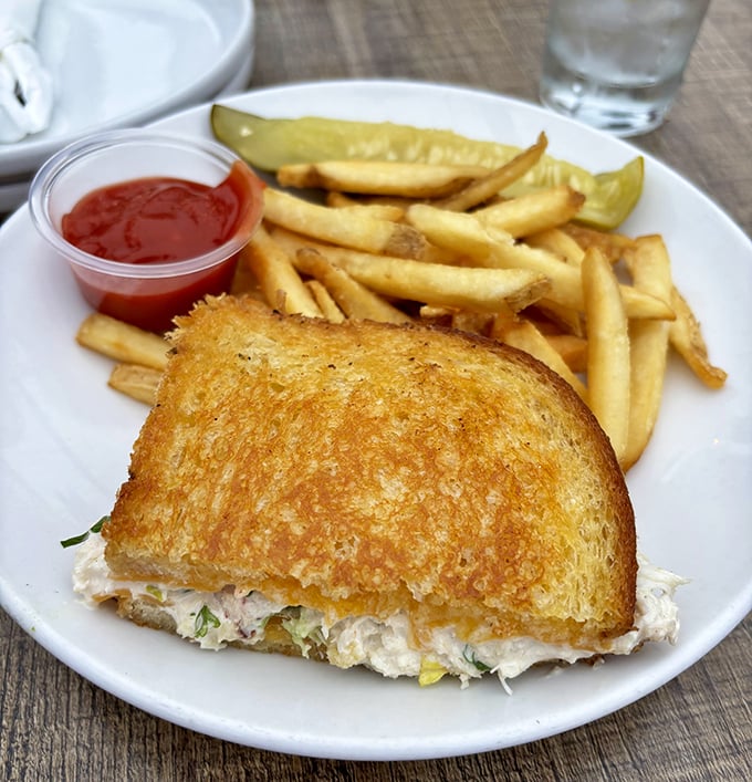 Golden-toasted bread embracing fresh crab meat—a sandwich that makes you wonder why you ever settled for tuna salad.