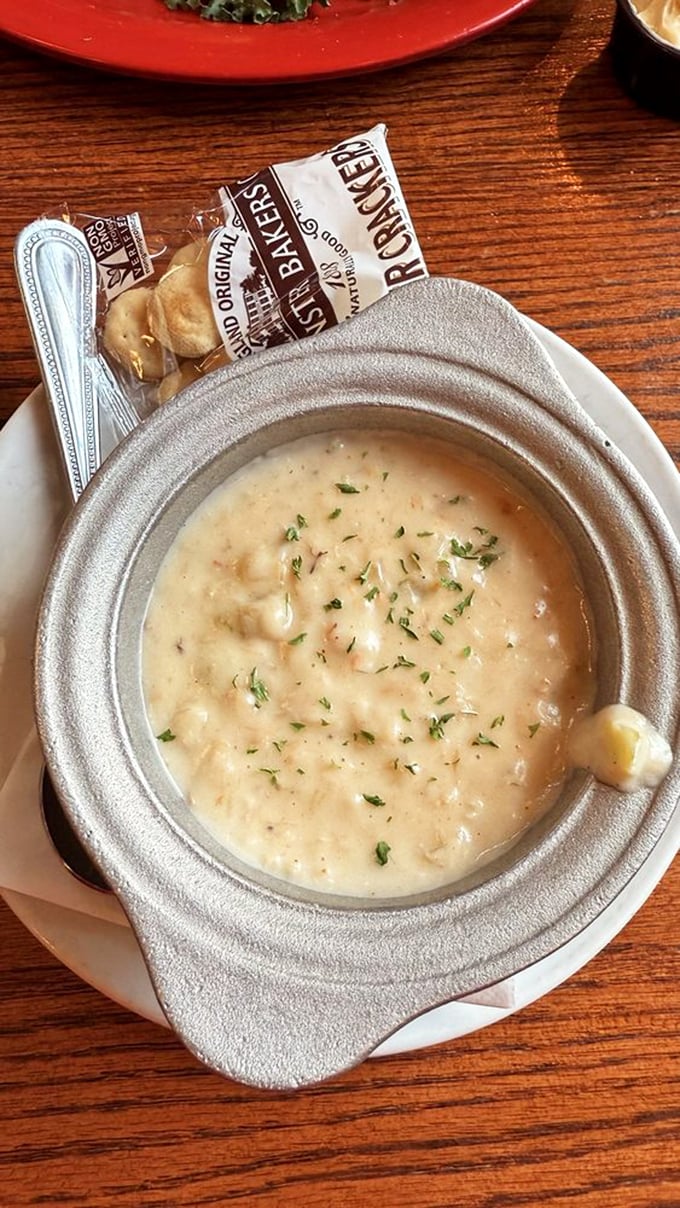 This isn't just soup—it's a warm hug in a bowl, where chunks of seafood play hide-and-seek in a velvety sea of flavor.