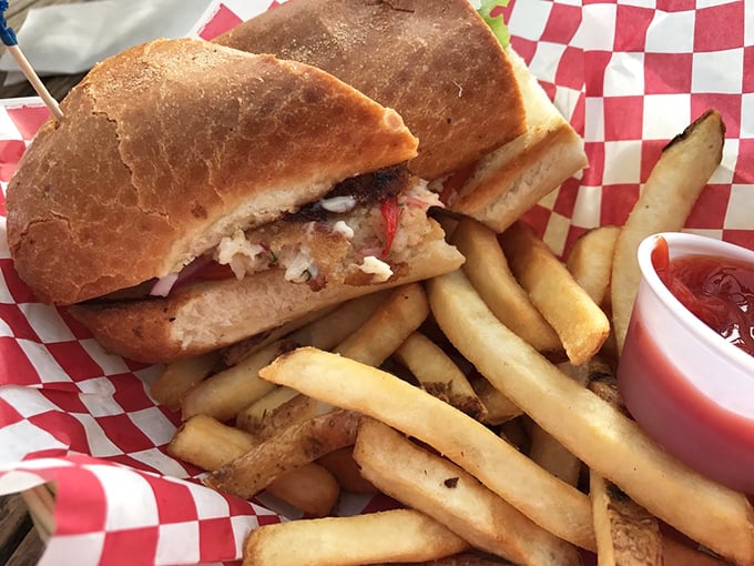 The sandwich that launched a thousand return trips: crispy fish nestled in fresh bread with just enough accompaniments to enhance, never overwhelm.