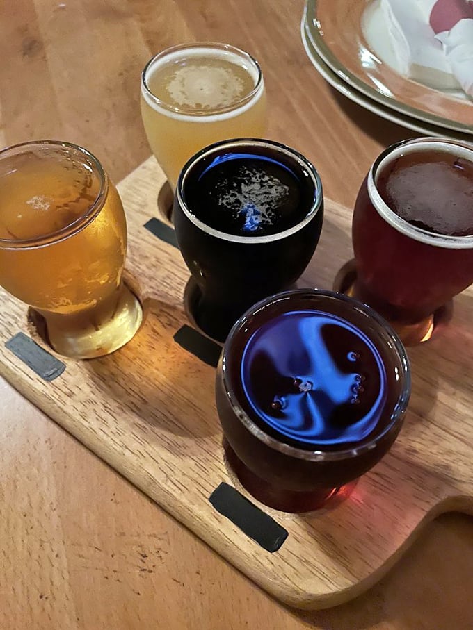 A flight of craft beers served on a wooden board – because proper barbecue deserves proper beverages to wash it down.