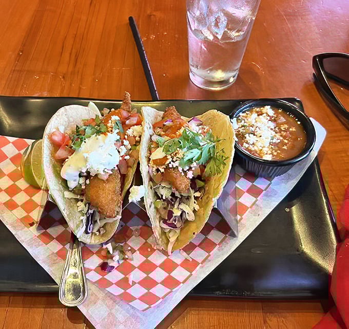 These fish tacos aren't just a meal, they're a San Diego handshake – crispy, fresh, and adorned with enough toppings to make a salad bar jealous.