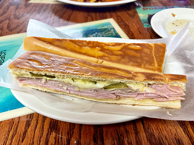 This Cuban sandwich isn't just pressed—it's been persuaded into perfection. Layers of ham, pork, and pickle in harmonious, crispy union.