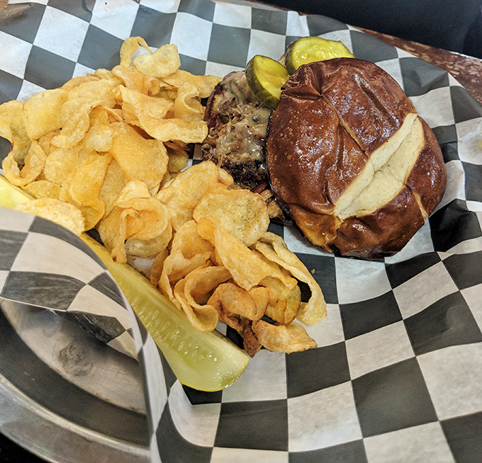 The Cubano sandwich arrives with chips crisp enough to alert neighboring tables. That pickle isn't a garnish—it's an essential supporting character in this lunch drama.
