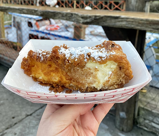 Deep-fried cheesecake dusted with powdered sugar—where dessert meets carnival food in a romance that would make your cardiologist nervous.