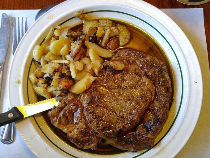 A steak that demands respect and rewards patience. Those perfectly roasted potatoes are no mere sidekicks—they're co-stars in this meaty drama.