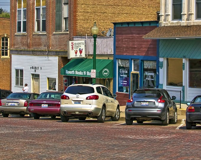 Svert's Steaks & Seafood beckons hungry visitors with its emerald awning – a culinary lighthouse on a sea of brick pavement.