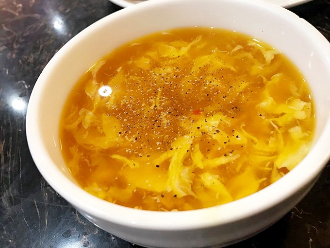 The egg drop soup – a golden pool of comfort that "prepares the stomach" according to buffet veterans. Wisdom in a bowl.