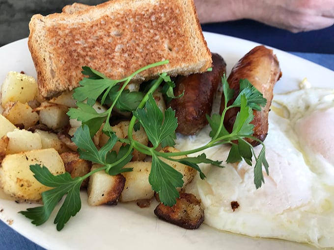 When eggs meet sausage on perfectly seasoned home fries, breakfast magic happens before your very eyes.