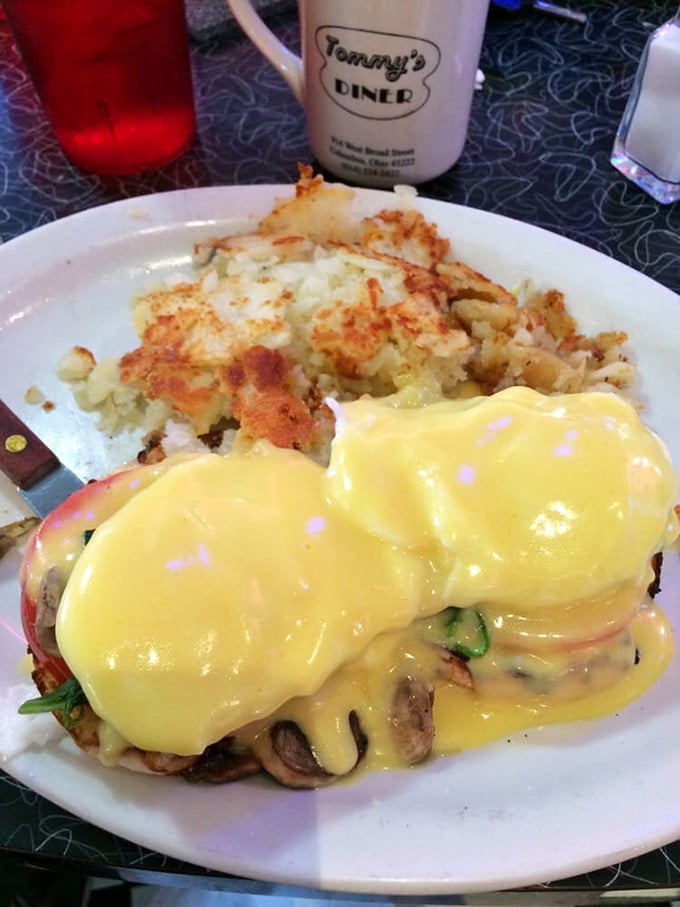 Eggs Benedict that would make the Pope jealous. That hollandaise sauce isn't just yellow—it's liquid sunshine on a plate.