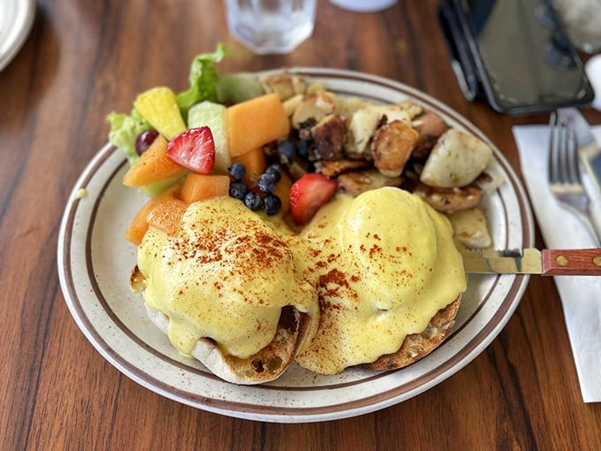 Benedict done right is a beautiful thing. Golden hollandaise cascades over perfectly poached eggs, accompanied by a rainbow of fresh fruit.