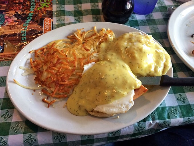 Eggs Benedict that would make a brunch snob weep with joy, paired with hash browns that achieve the golden-crisp ideal.