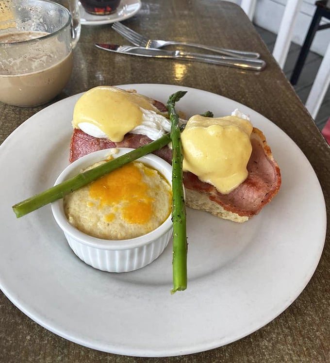 Eggs Benedict reimagined with thick-cut ham and asparagus – proof that classics can be improved upon, like when they added color to The Wizard of Oz.