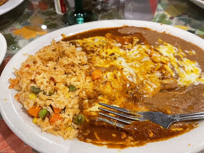 When enchiladas meet eggs, magic happens. The sauce doesn't just cover the dish—it embraces it like a warm, spicy blanket.